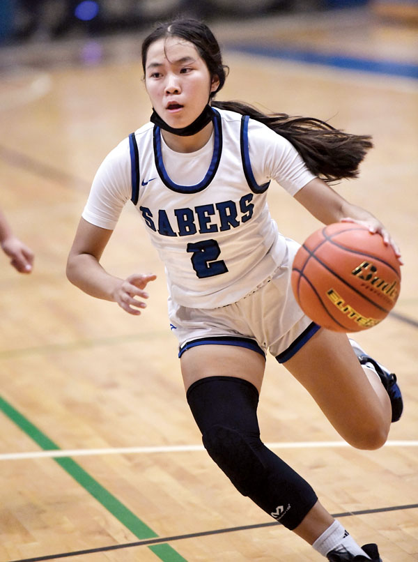 Maui High’s Jacy Anne Dela Cruz drives in the first quarter against ...